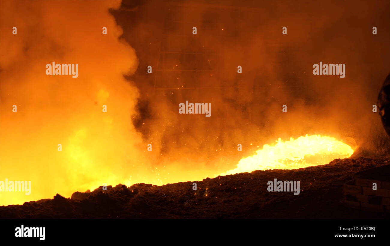 Liquid metal from blast furnace. Liquid metal pouring stream Stock ...