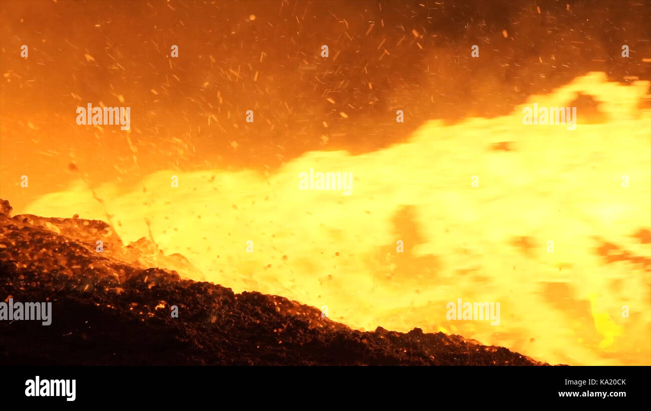 Pouring of liquid metal in open-hearth furnace. Hot steel pouring ...