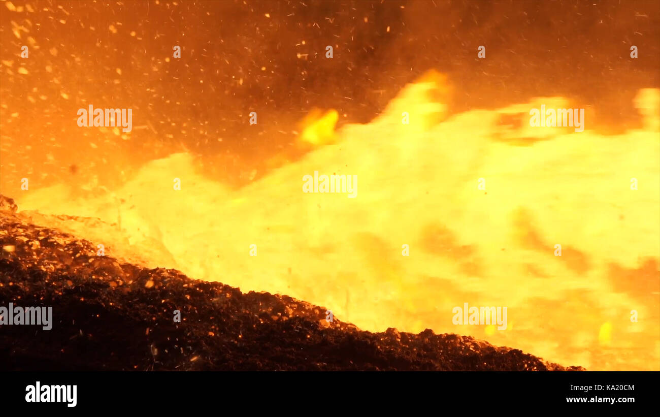 Pouring of liquid metal in open-hearth furnace. Hot steel pouring ...