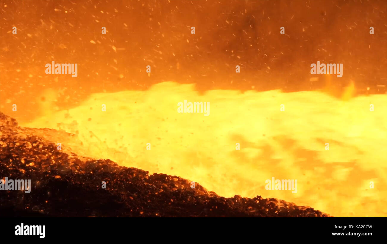 Pouring of liquid metal in open-hearth furnace. Hot steel pouring ...