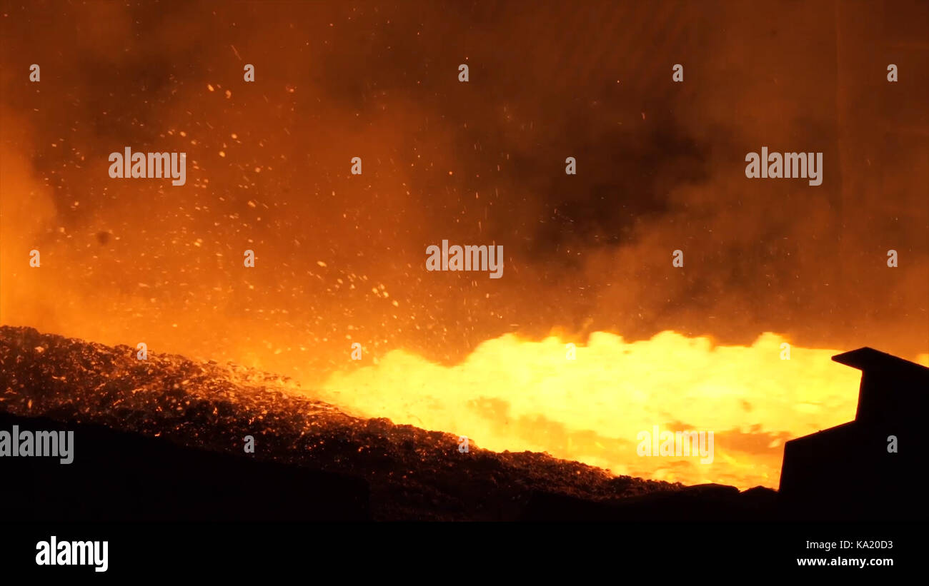 Pouring of liquid metal in open-hearth furnace. Hot steel pouring ...