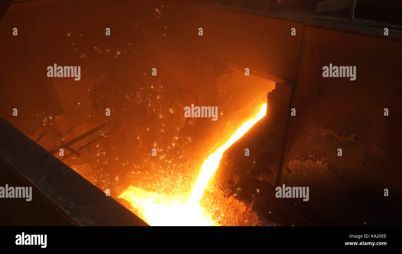 Liquid metal from blast furnace. Liquid iron from ladle in the ...