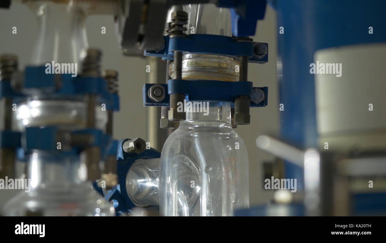 Liquid flows through a transparent pipe. Experience in chemical ...