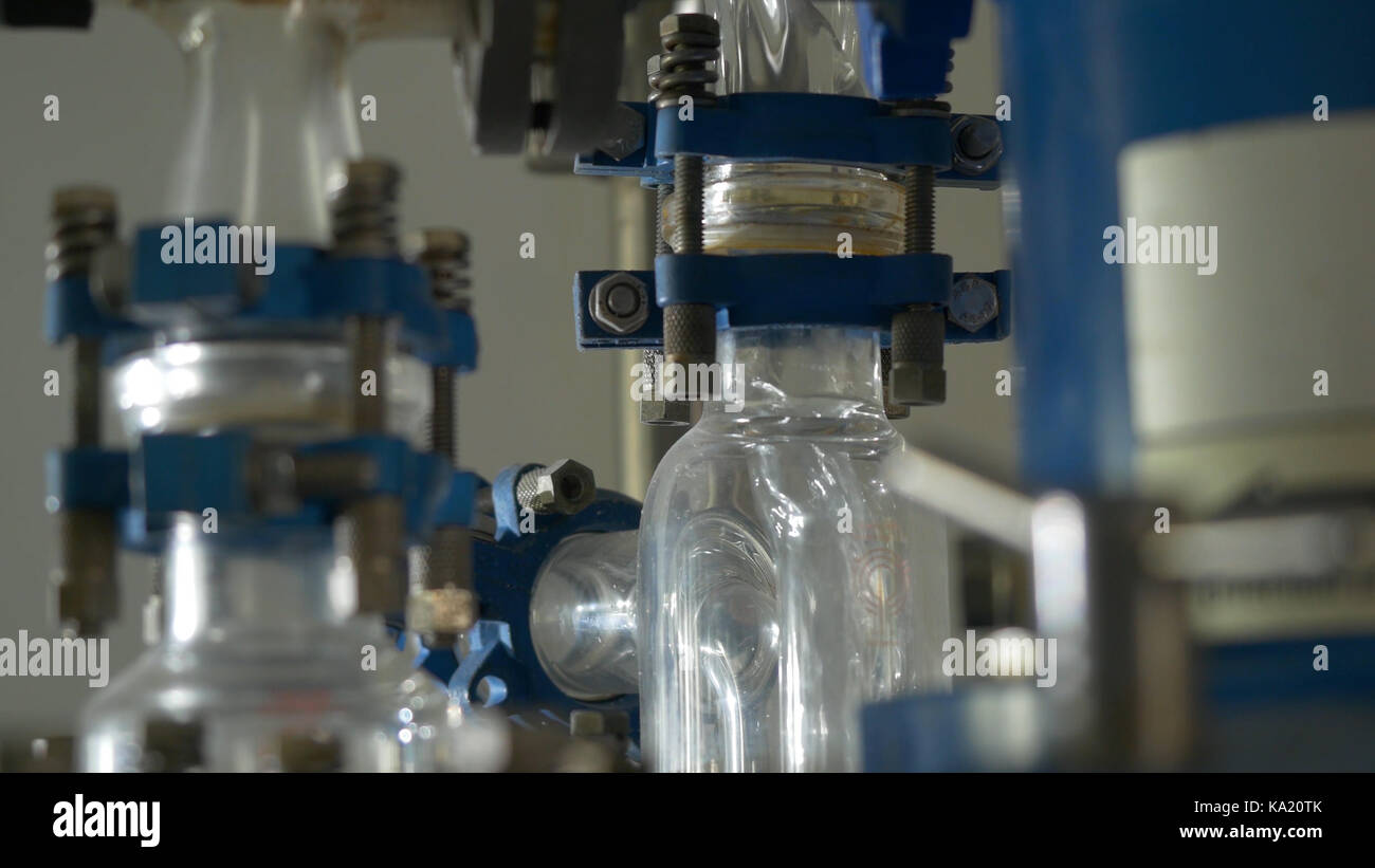 Liquid flows through a transparent pipe. Experience in chemical ...