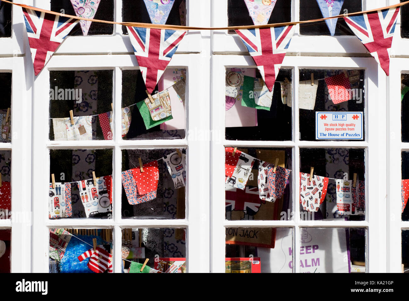 decorative union jack bunting on a show window Stock Photo - Alamy