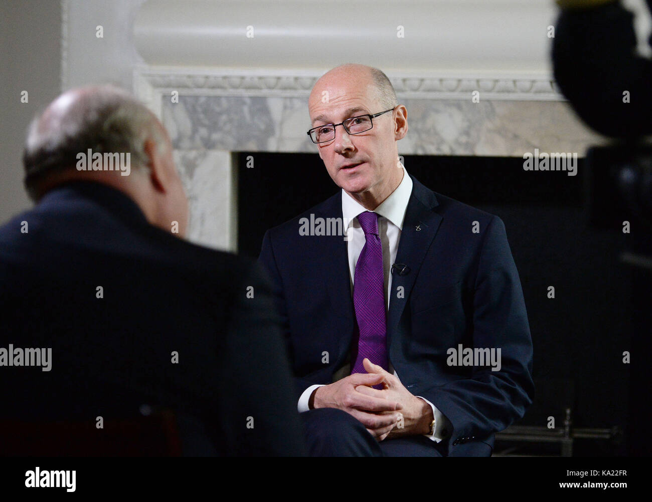 Scottish Deputy First Minister John Sweeney conducts a TV interview ...