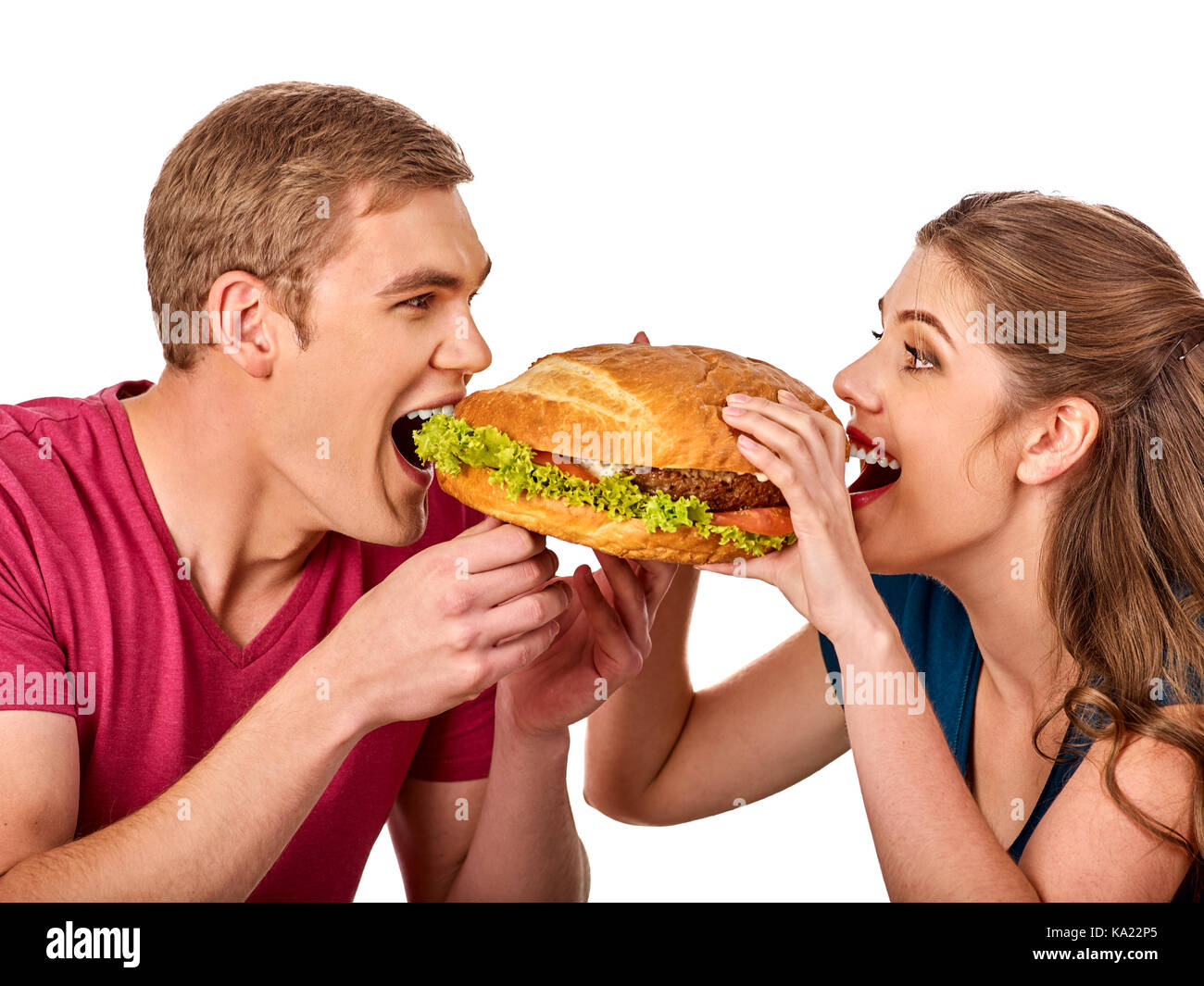 Couple eating fast food. Man and woman treat hamburger Stock Photo - Alamy