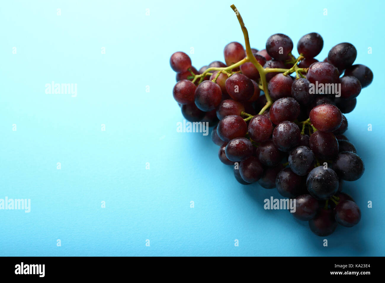 Blue food background with grape, food above Stock Photo - Alamy