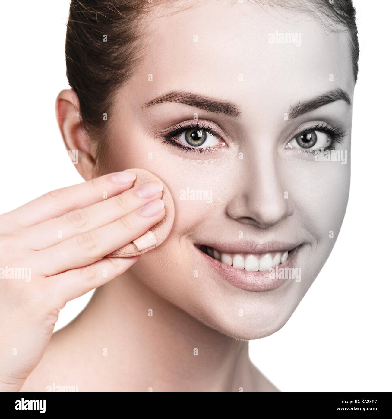 Young woman using cosmetics sponge Stock Photo - Alamy