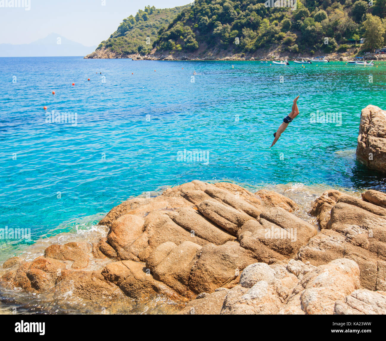 Summer Seascape, man jumping in the sea, summertime travel vacation ...