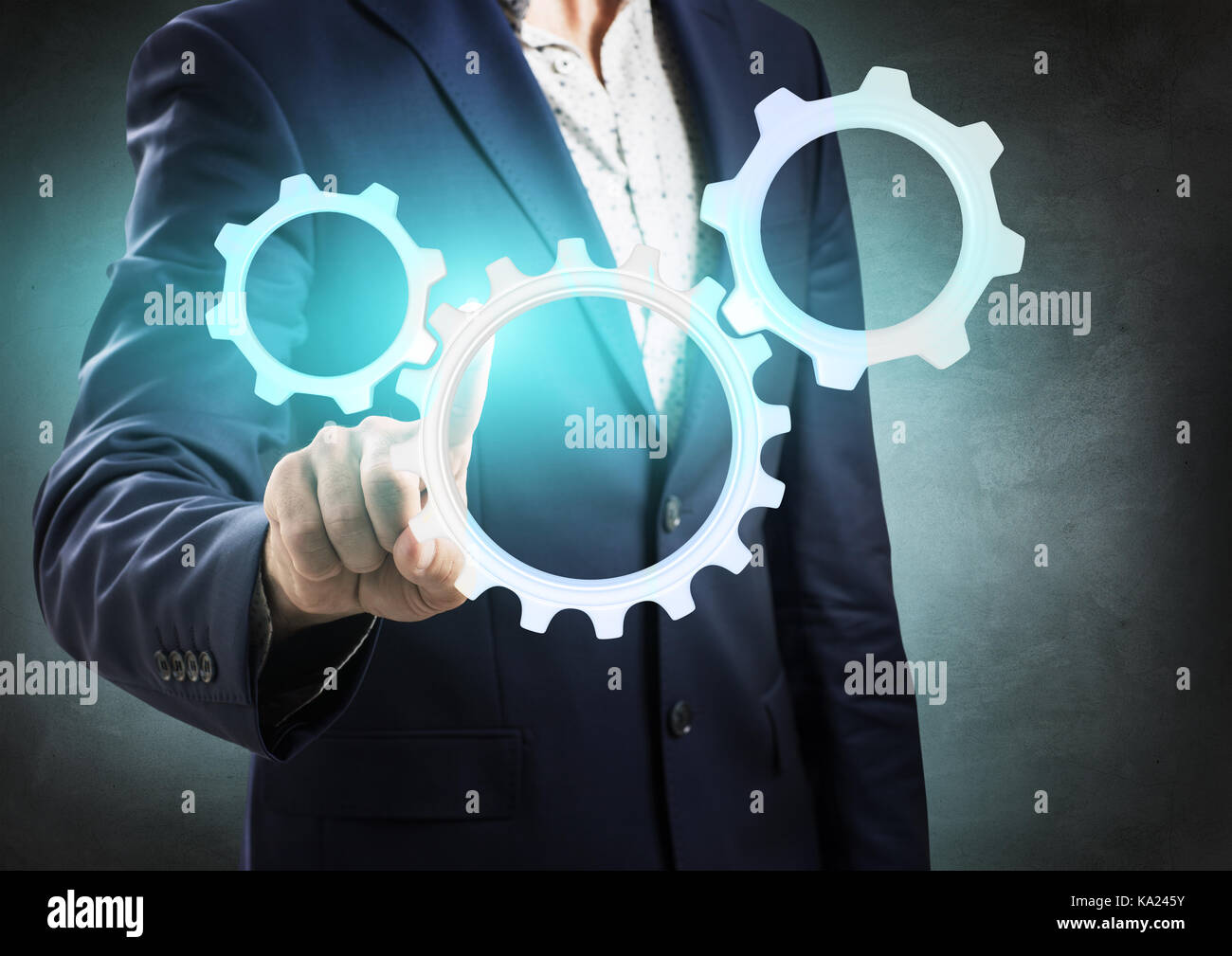 Businessman hand working cog gear hi-res stock photography and images ...