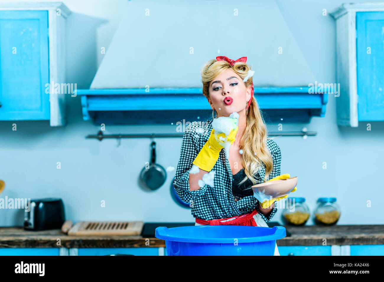 housewife blowing foam Stock Photo - Alamy