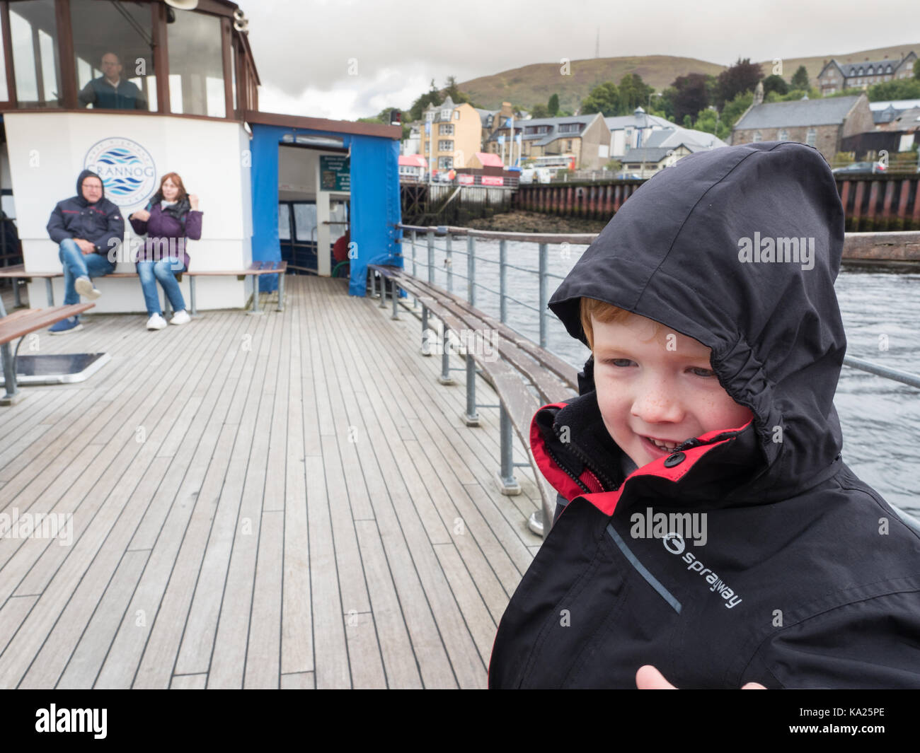 Smiling aboard the boat Stock Photo - Alamy