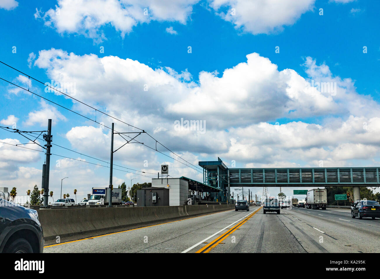 Commuters wait at a Metro Rail Station in Pasadena California as milder ...