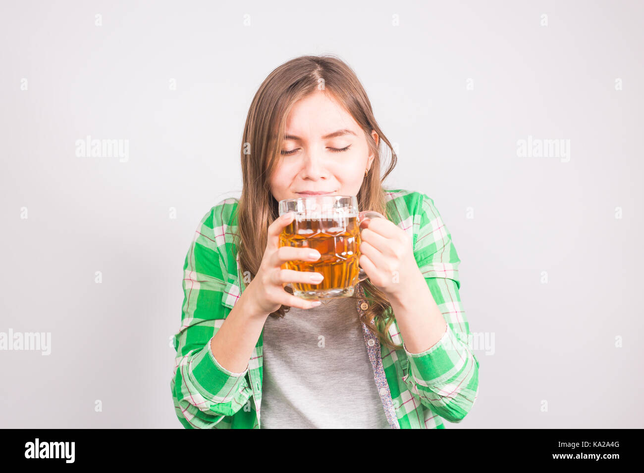 Beautiful young woman testing beer Stock Photo - Alamy