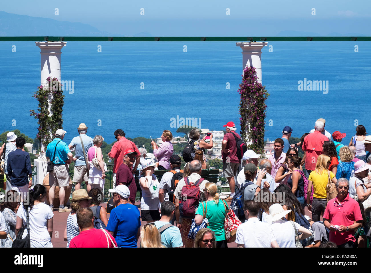 tourists and day trippers on a visit to the island of capri in the gulf ...
