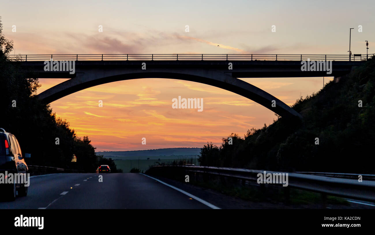 Motorway bridge at sunset Stock Photo - Alamy