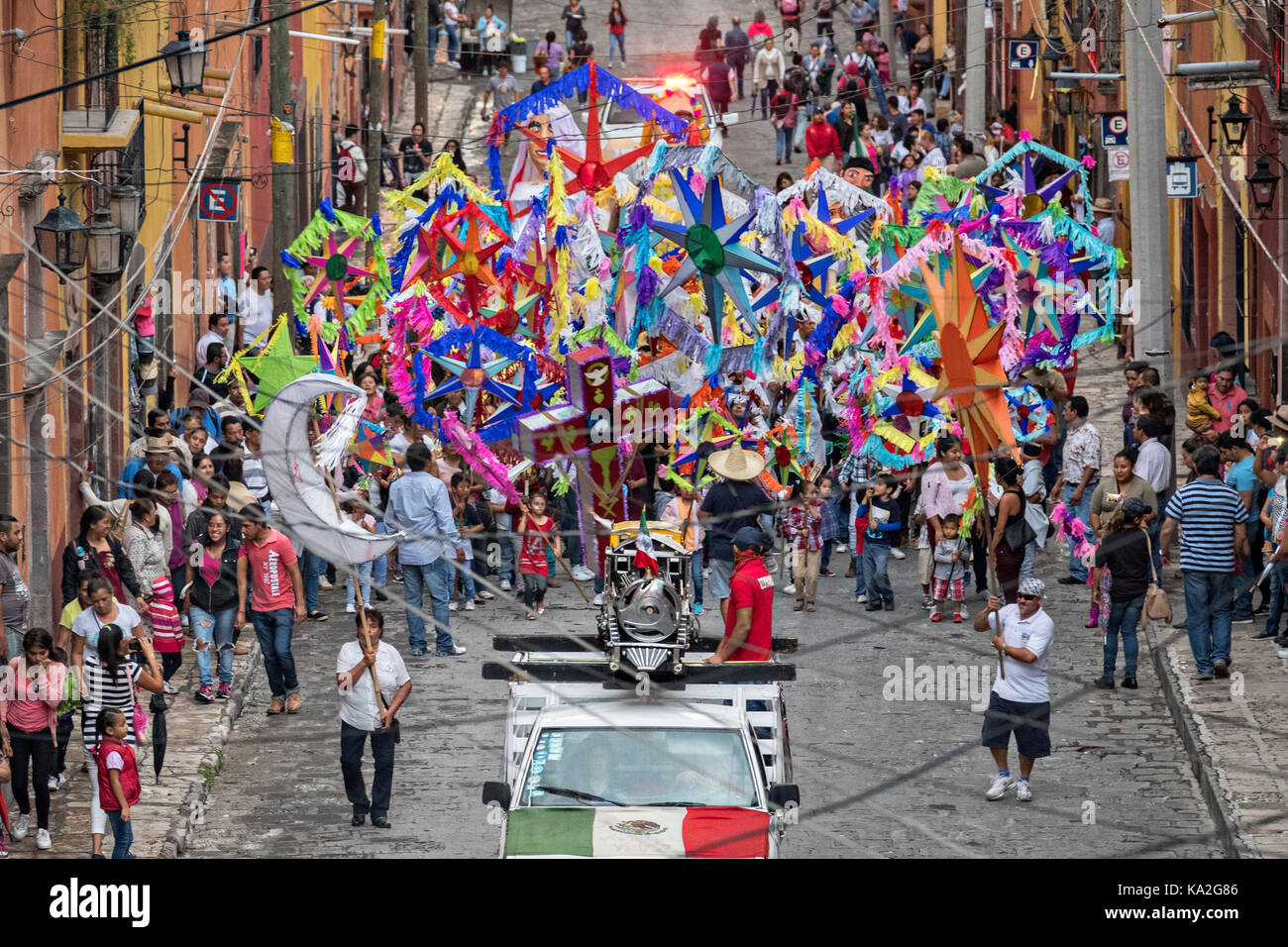 Railroad workers lead a fiesta procession through the city at the start ...