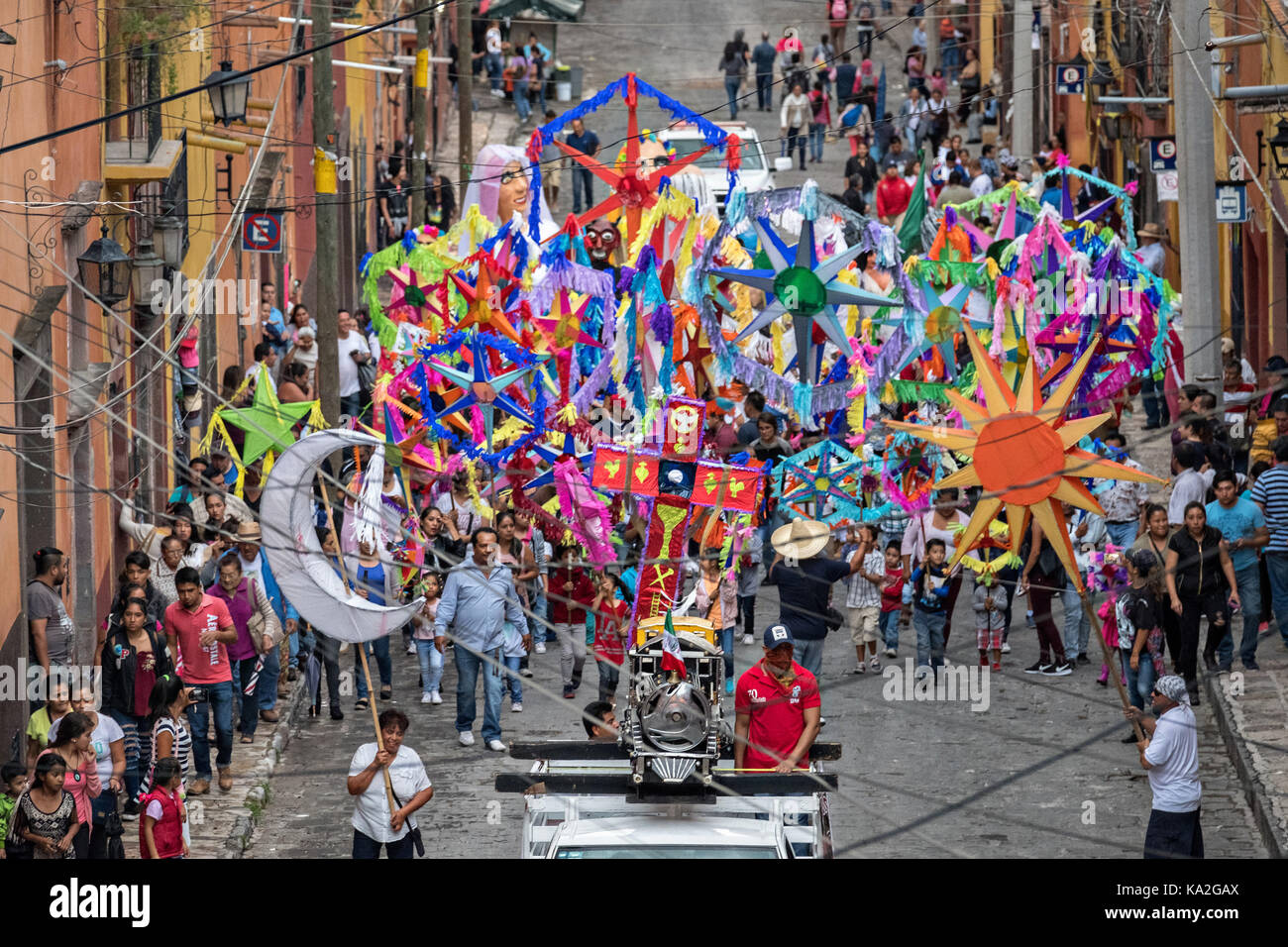 Railroad workers lead a fiesta procession through the city at the start ...