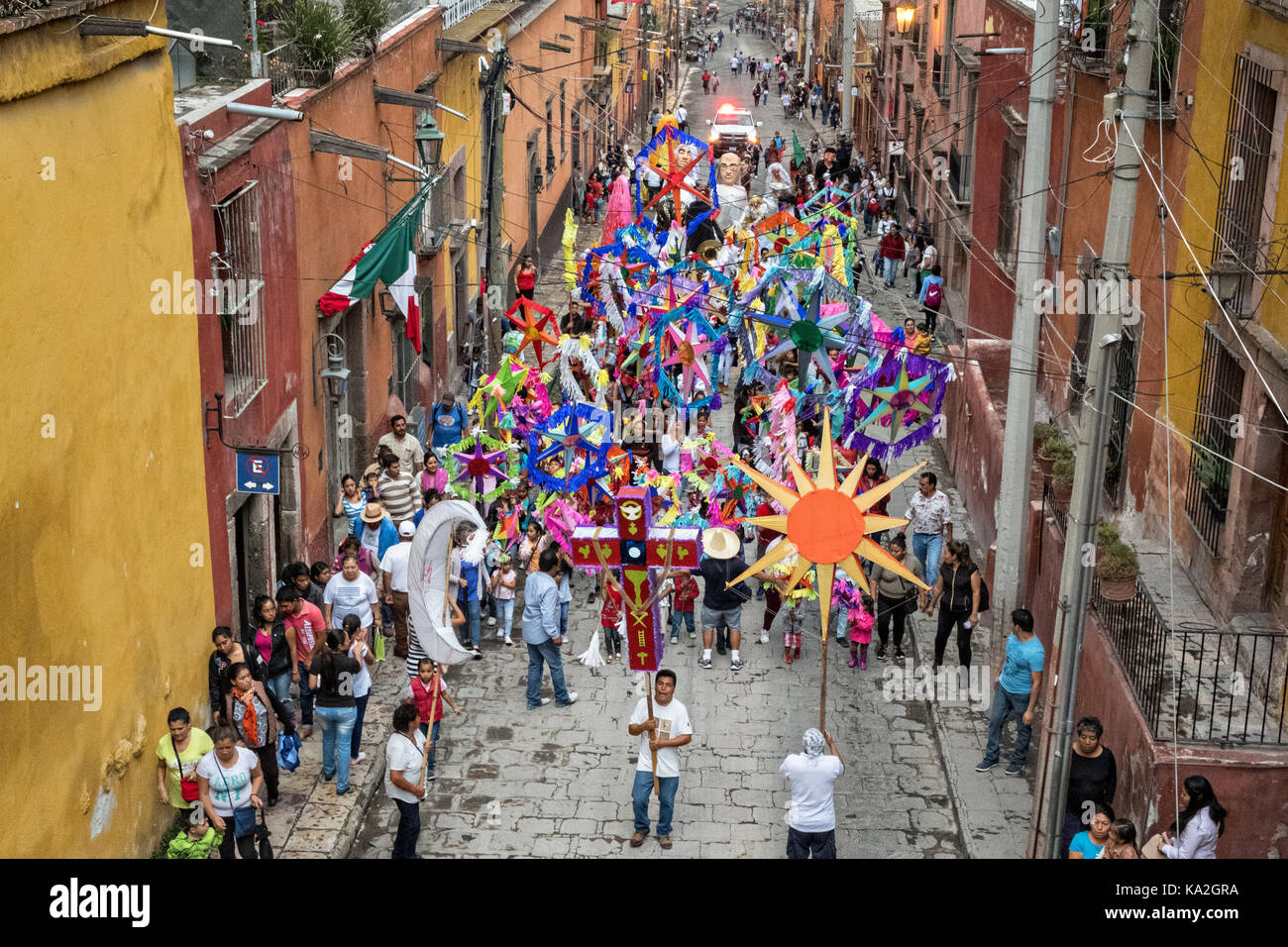 Railroad workers lead a fiesta procession through the city at the start ...