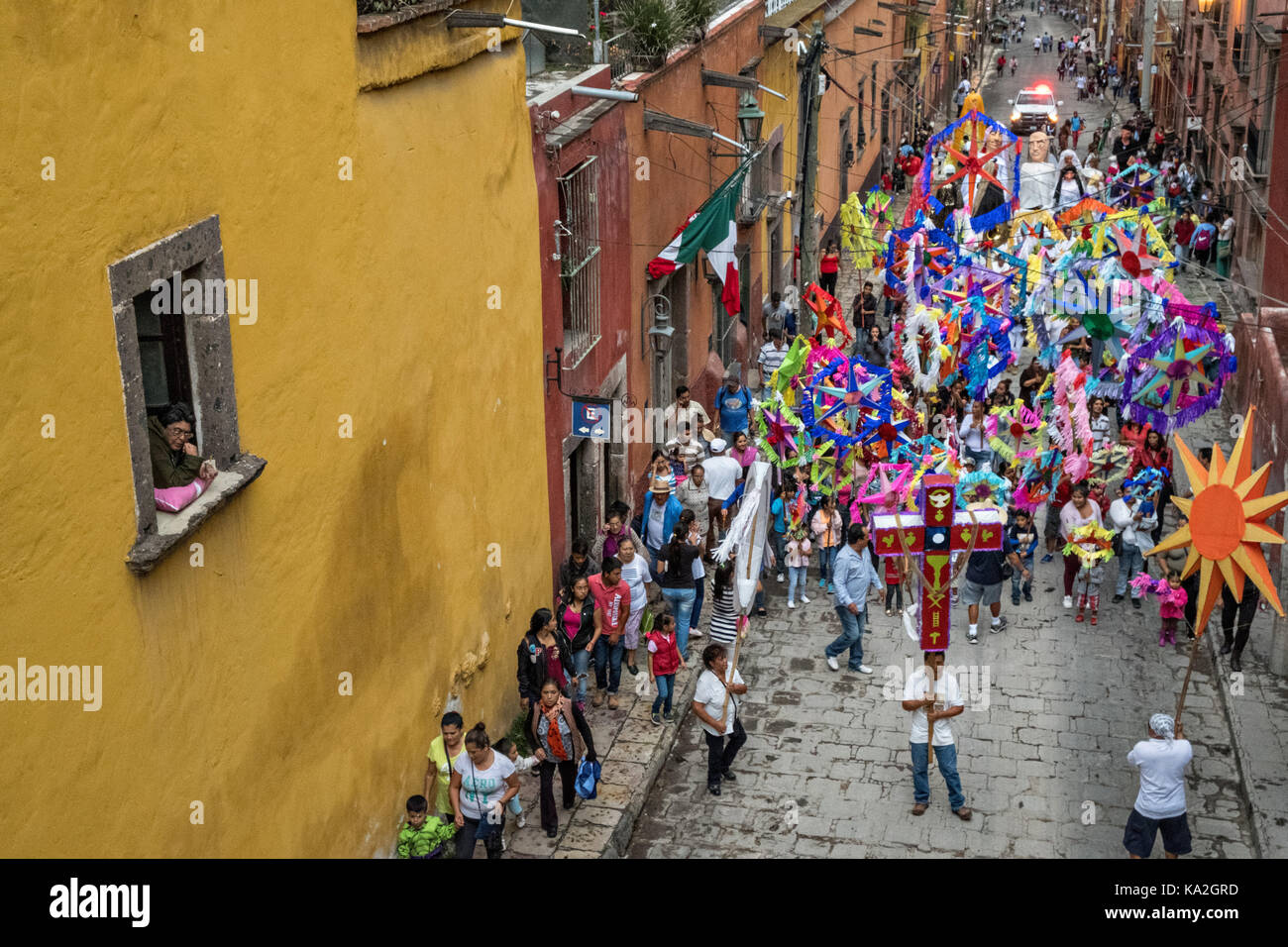 Railroad workers lead a fiesta procession through the city at the start ...