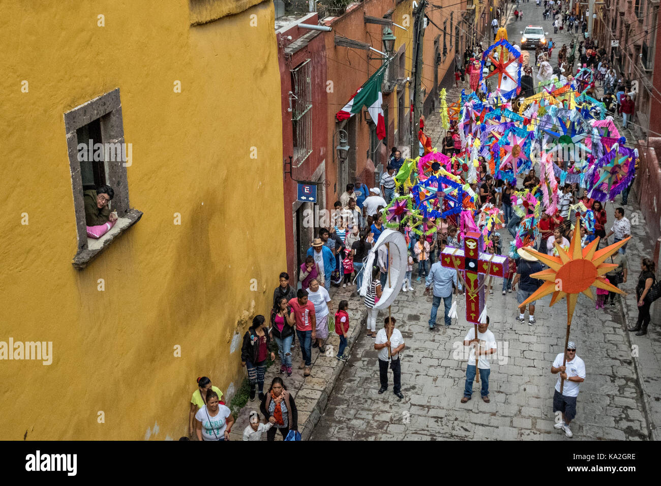 Railroad workers lead a fiesta procession through the city at the start ...