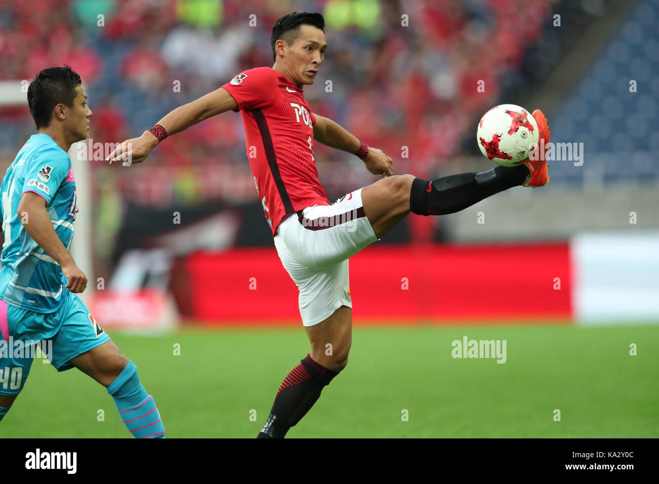 Saitama, Japan. 23rd Sep, 2017. Yuji Ono (Sagan), Tomoaki Makino (Reds ...