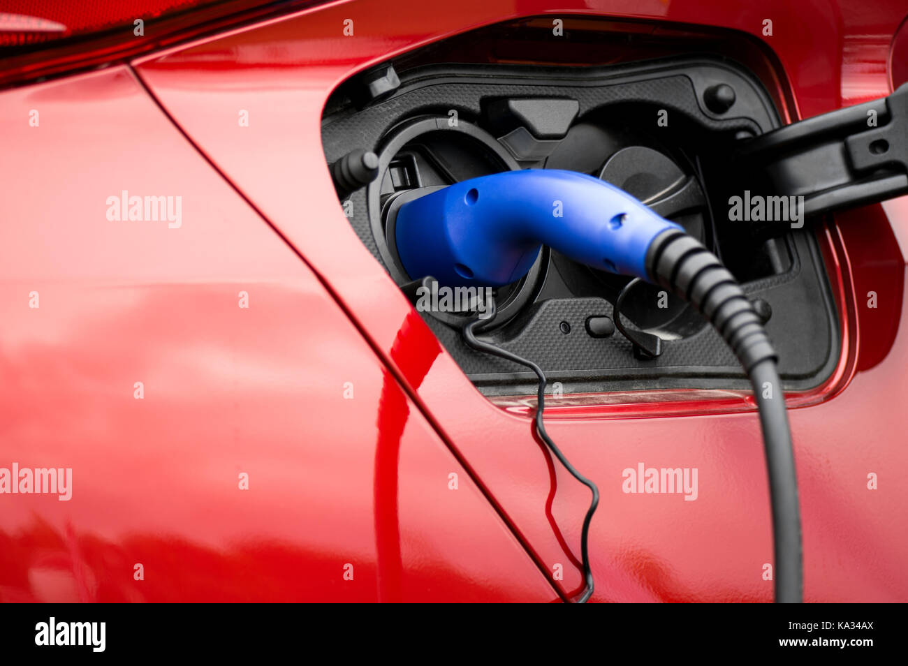 Close-up of power plug-in in electric car Stock Photo - Alamy