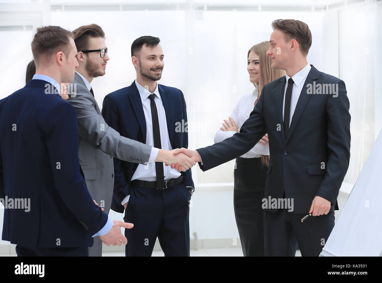 handshake Manager and the client in the office Stock Photo - Alamy