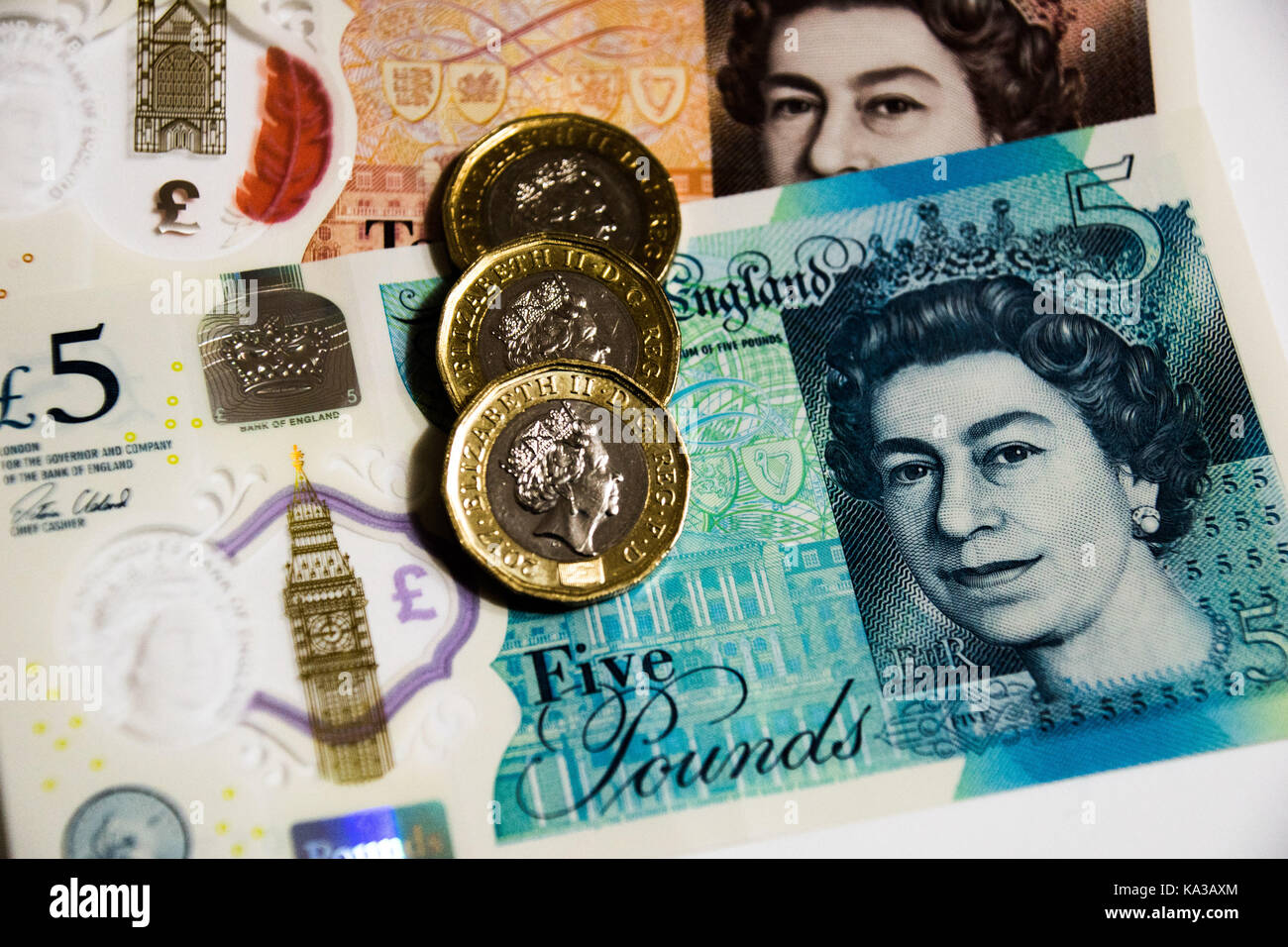 Polymer currency note and twelve sided pound sterling coin in full ...