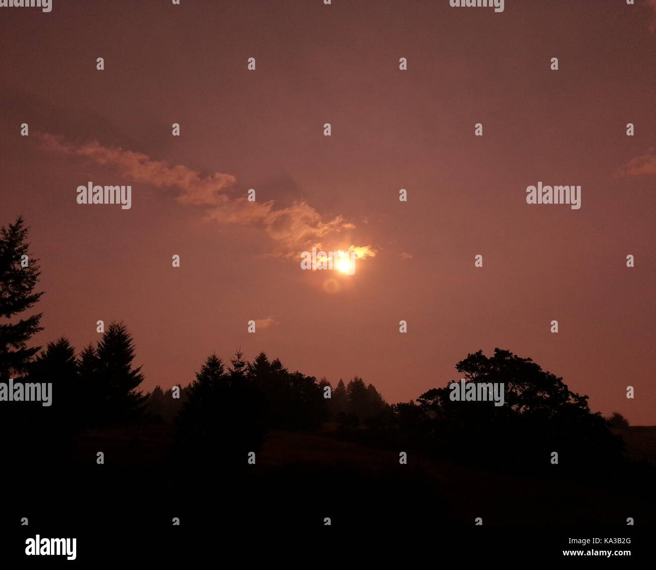 Sun Behind a Cloud Stock Photo - Alamy
