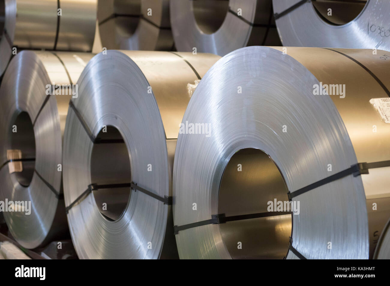 Steel rolls ready for processing in a factory Stock Photo - Alamy