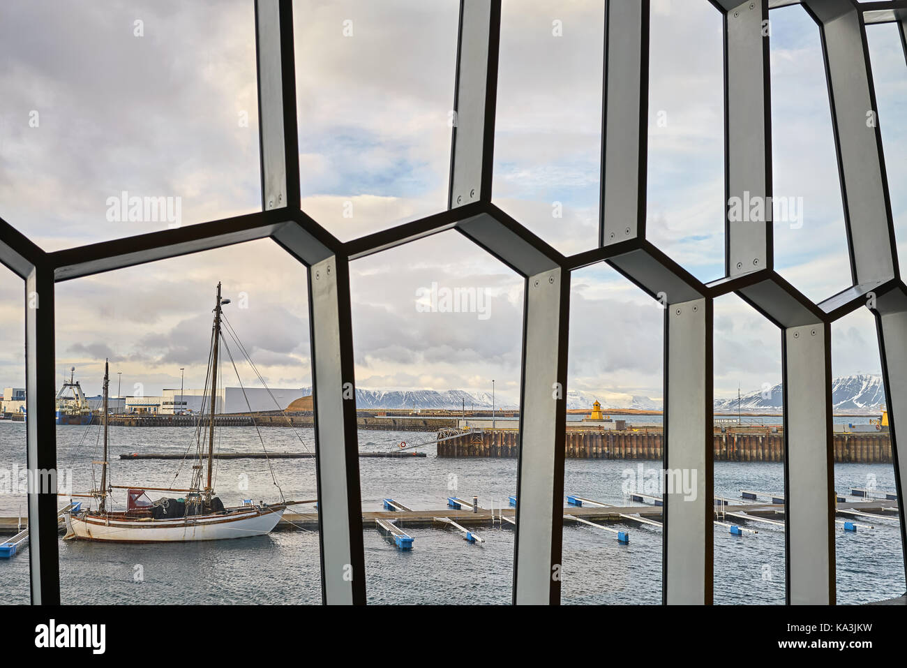 Look through patterned windows at the dockside on the background of ...