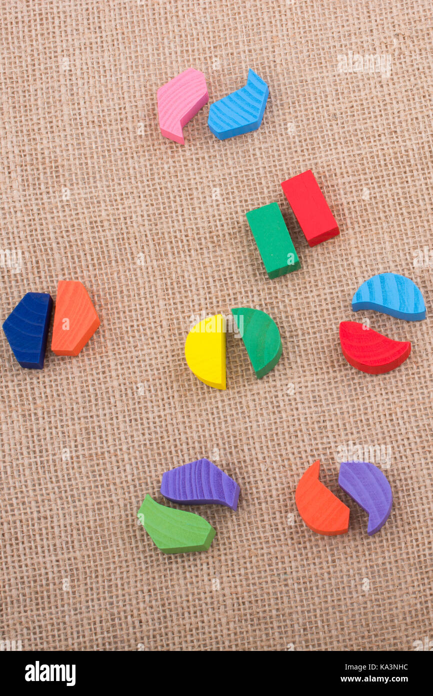 Colorful wooden pieces of a logic puzzle Stock Photo - Alamy