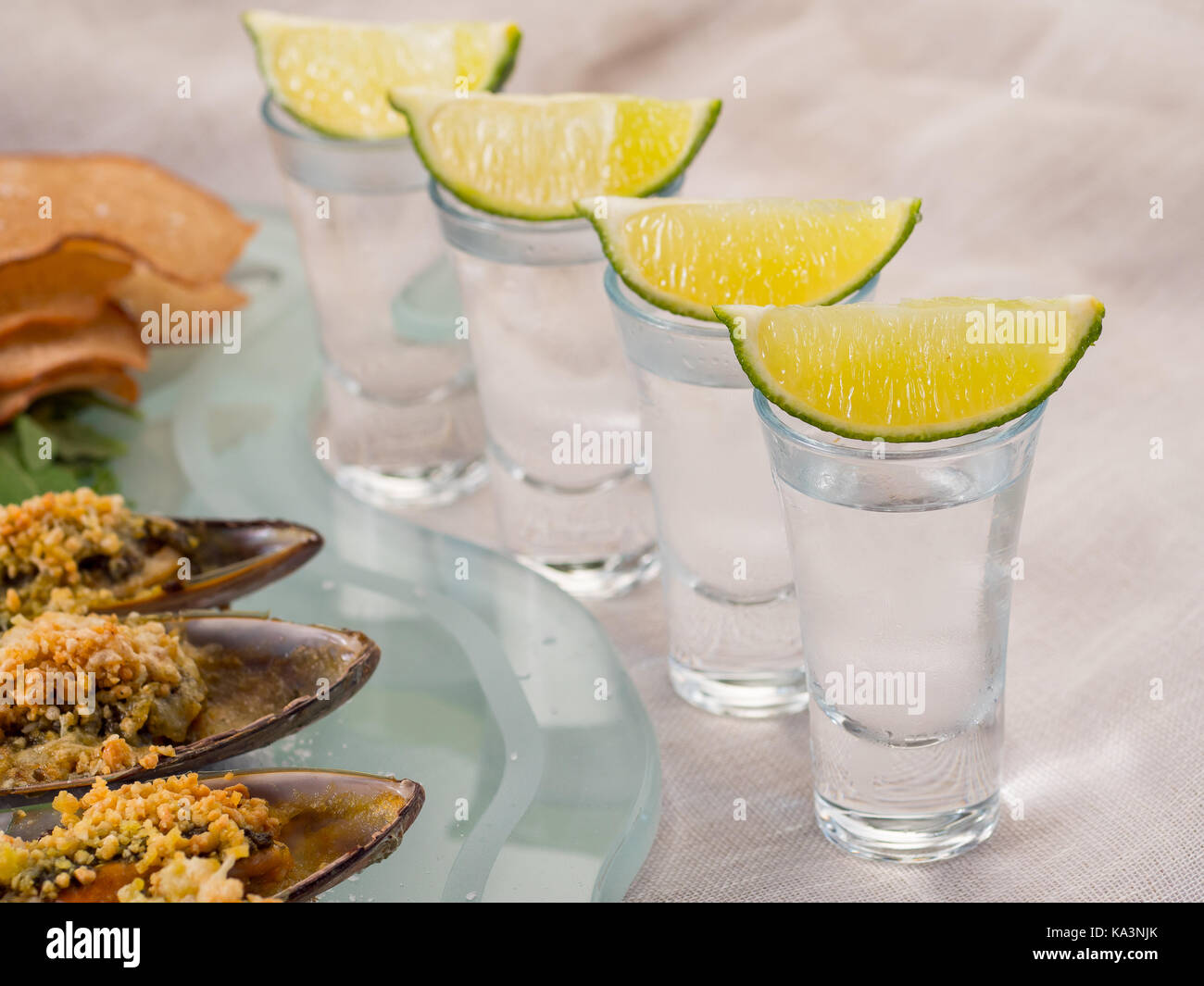 Cocktail. Vodka, gin, tequila with lime in restaurant Stock Photo - Alamy