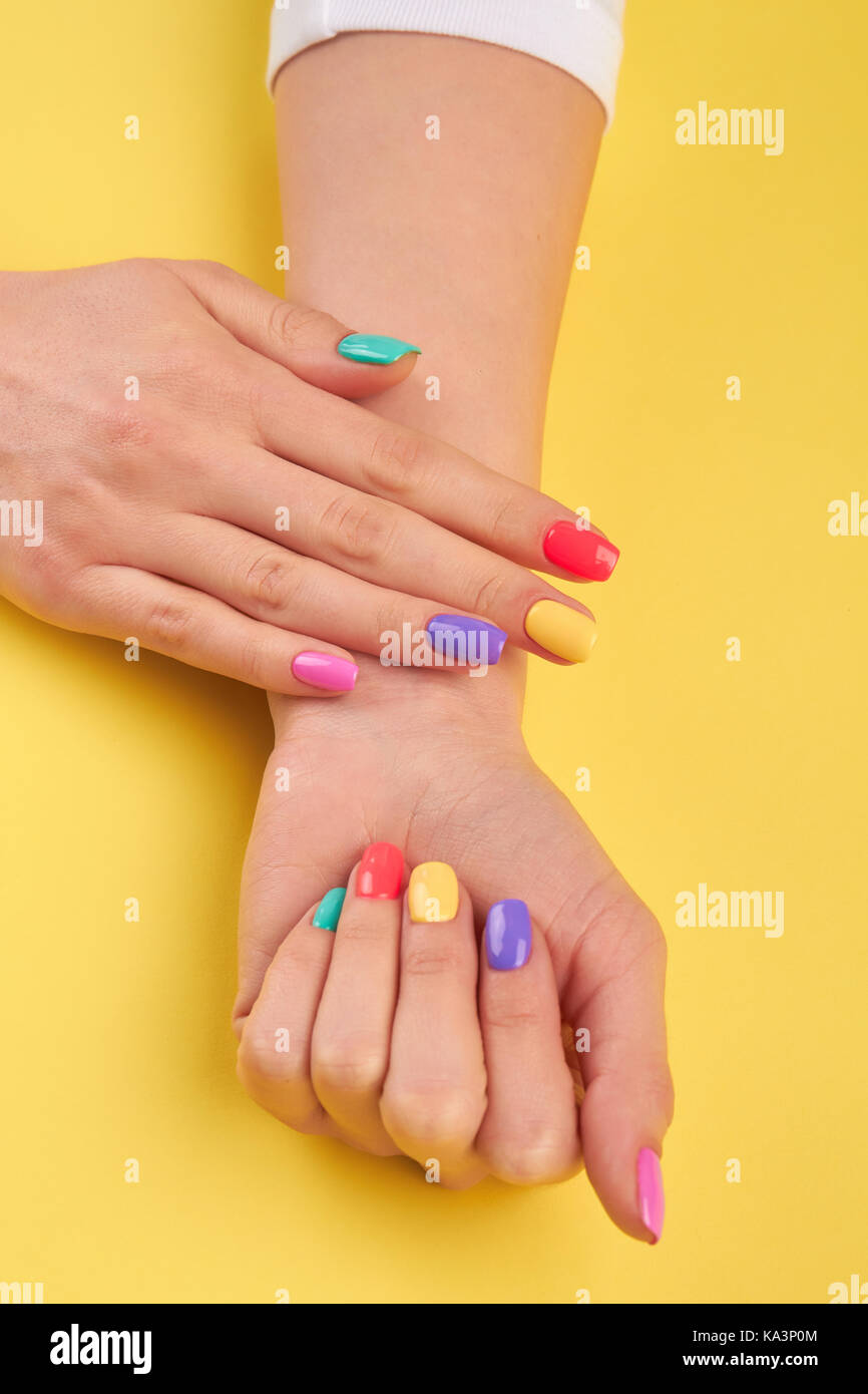 Womans hands with summer colors nails. Multicolor female manicure on ...