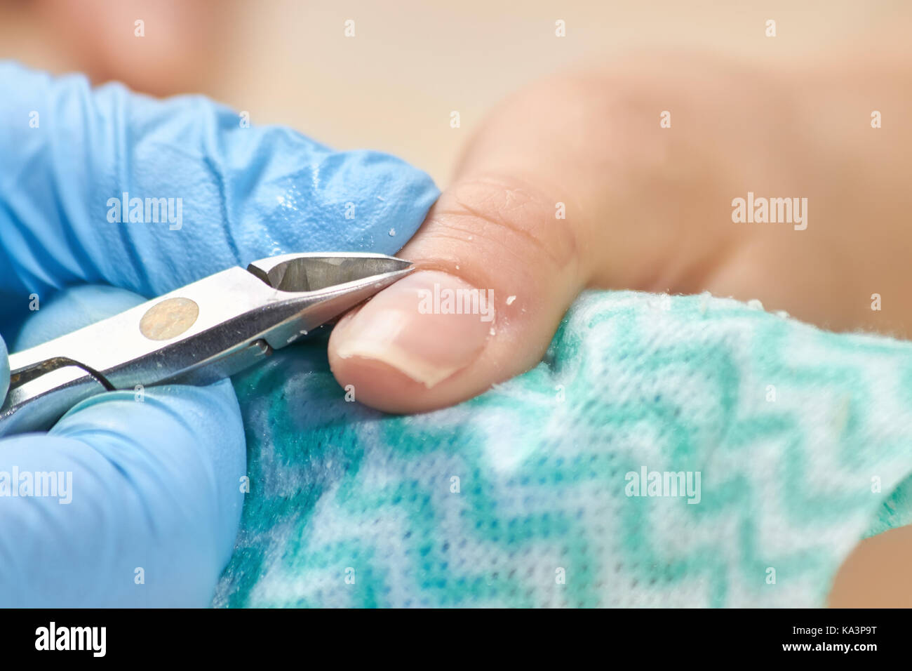 Woman using nail cutter hi-res stock photography and images - Alamy
