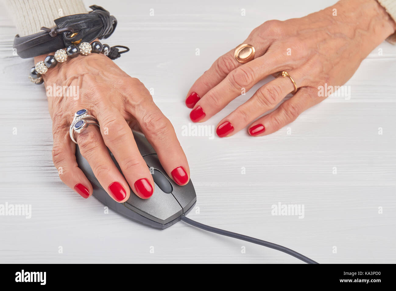 Female hands working with computer mouse. Businesswoman hands with ...