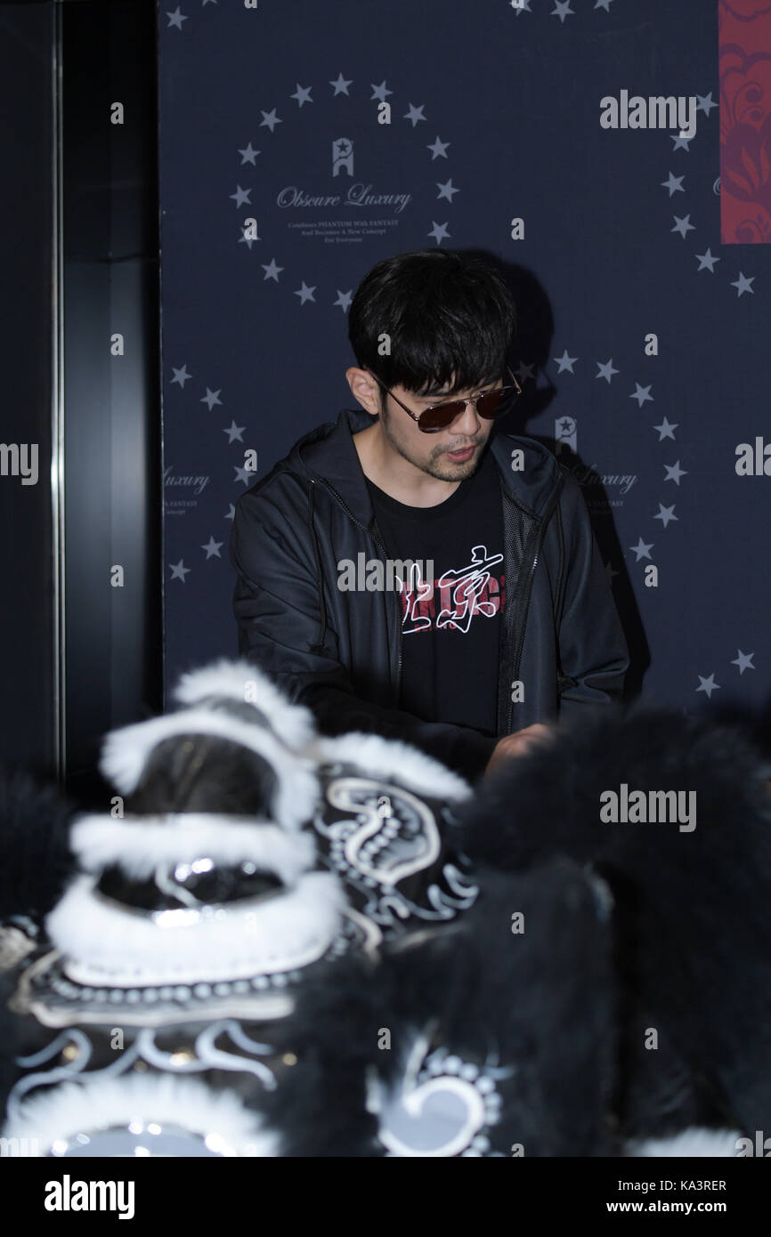 Jay Chou attends the opening ceremony for a new store for his clothing ...