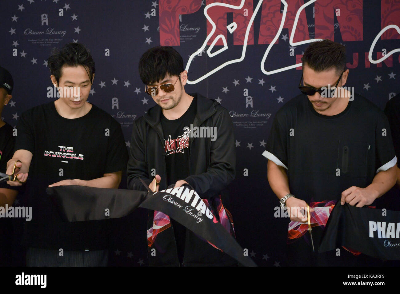 Jay Chou attends the opening ceremony for a new store for his clothing ...