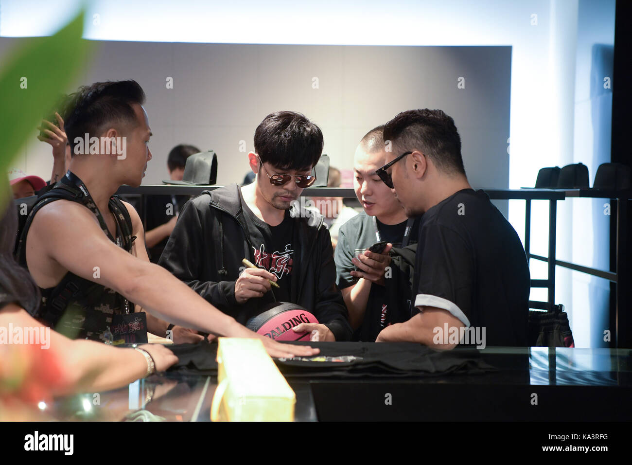 Jay Chou attends the opening ceremony for a new store for his clothing ...