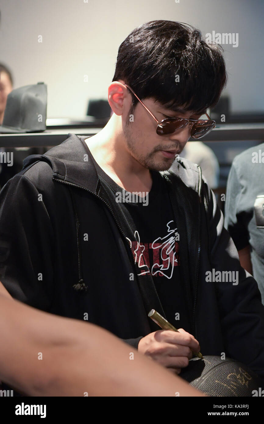 Jay Chou attends the opening ceremony for a new store for his clothing ...