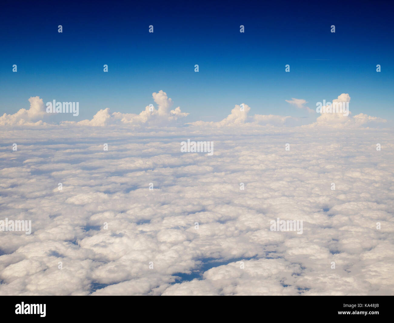A line of developing thunderstorms viewed from a commercial aircraft at ...