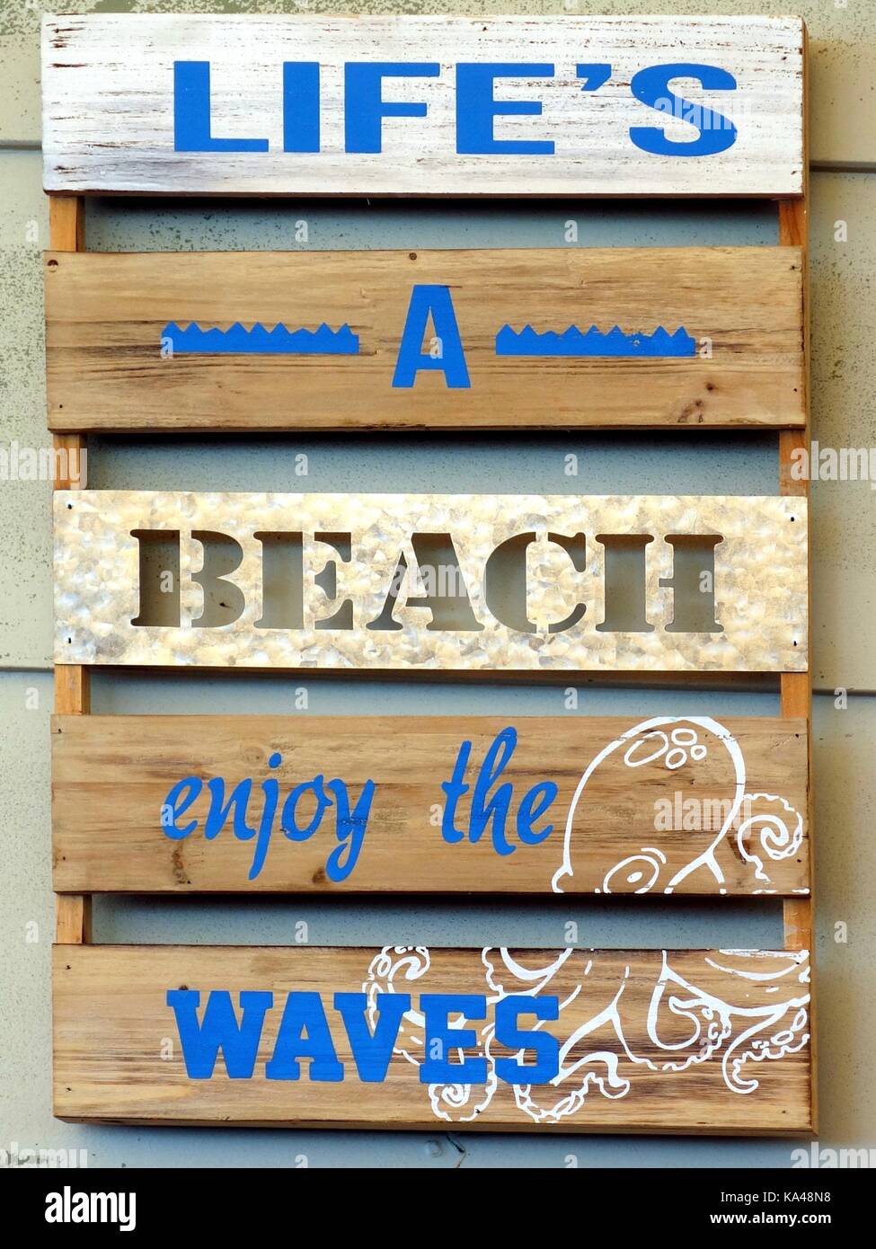 A sign at a Australia beach depicting enjoyment Stock Photo - Alamy