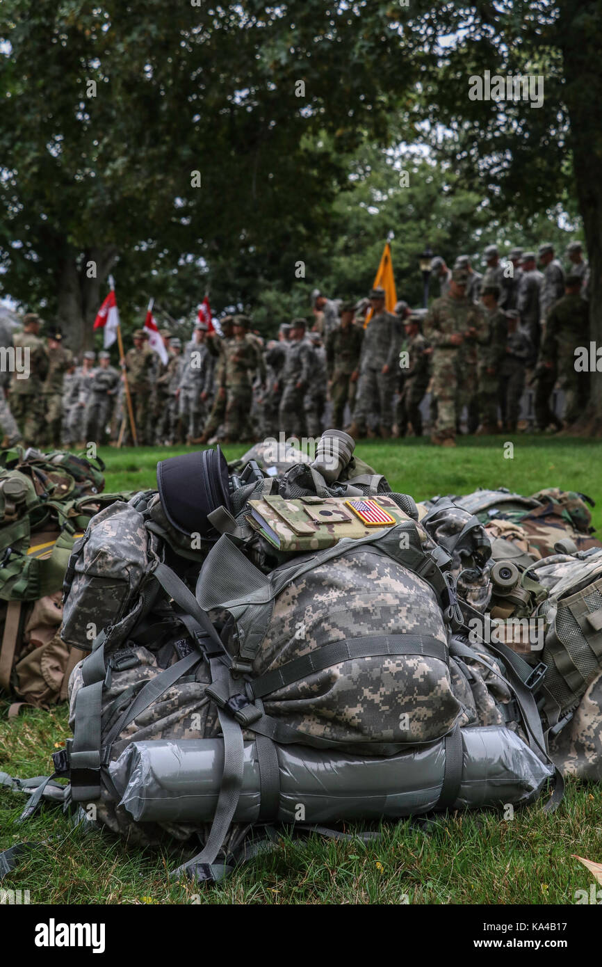 Soldiers backpack in foreground of standing soldiers Stock Photo - Alamy