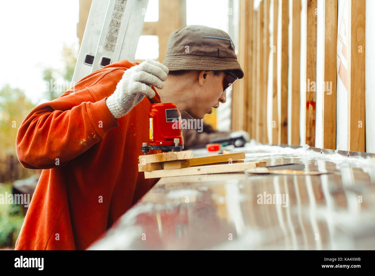 Use of the measuring tool for level installation Stock Photo - Alamy