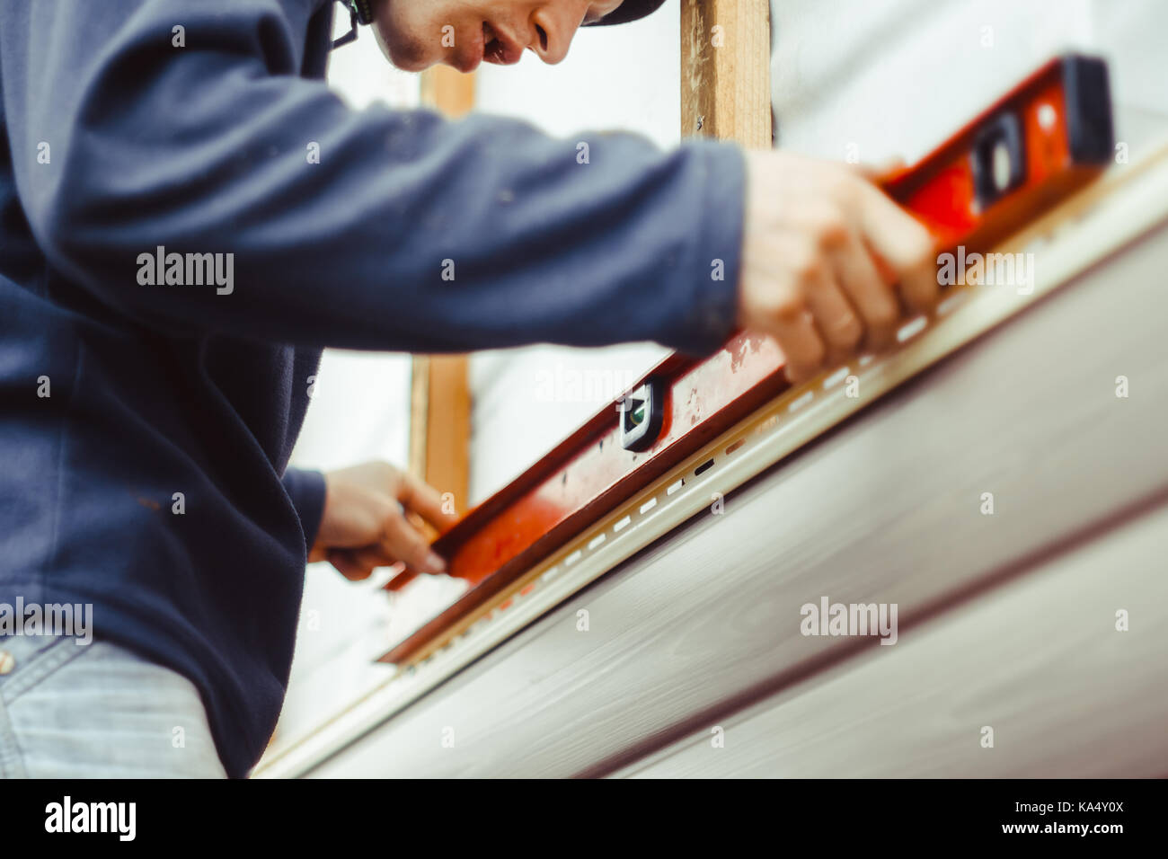 Use of the measuring tool for level installation Stock Photo - Alamy