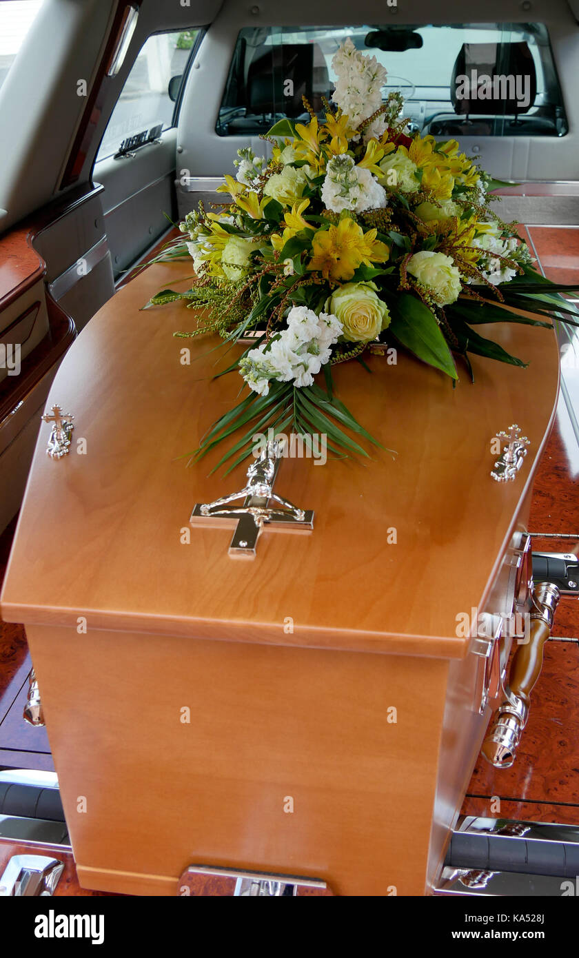 closeup shot of a colorful casket in a hearse or chapel before funeral ...