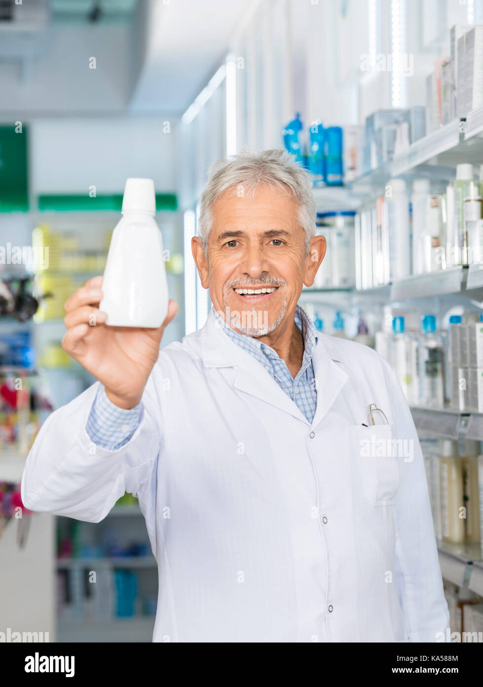 Senior male chemist holding hi-res stock photography and images - Alamy