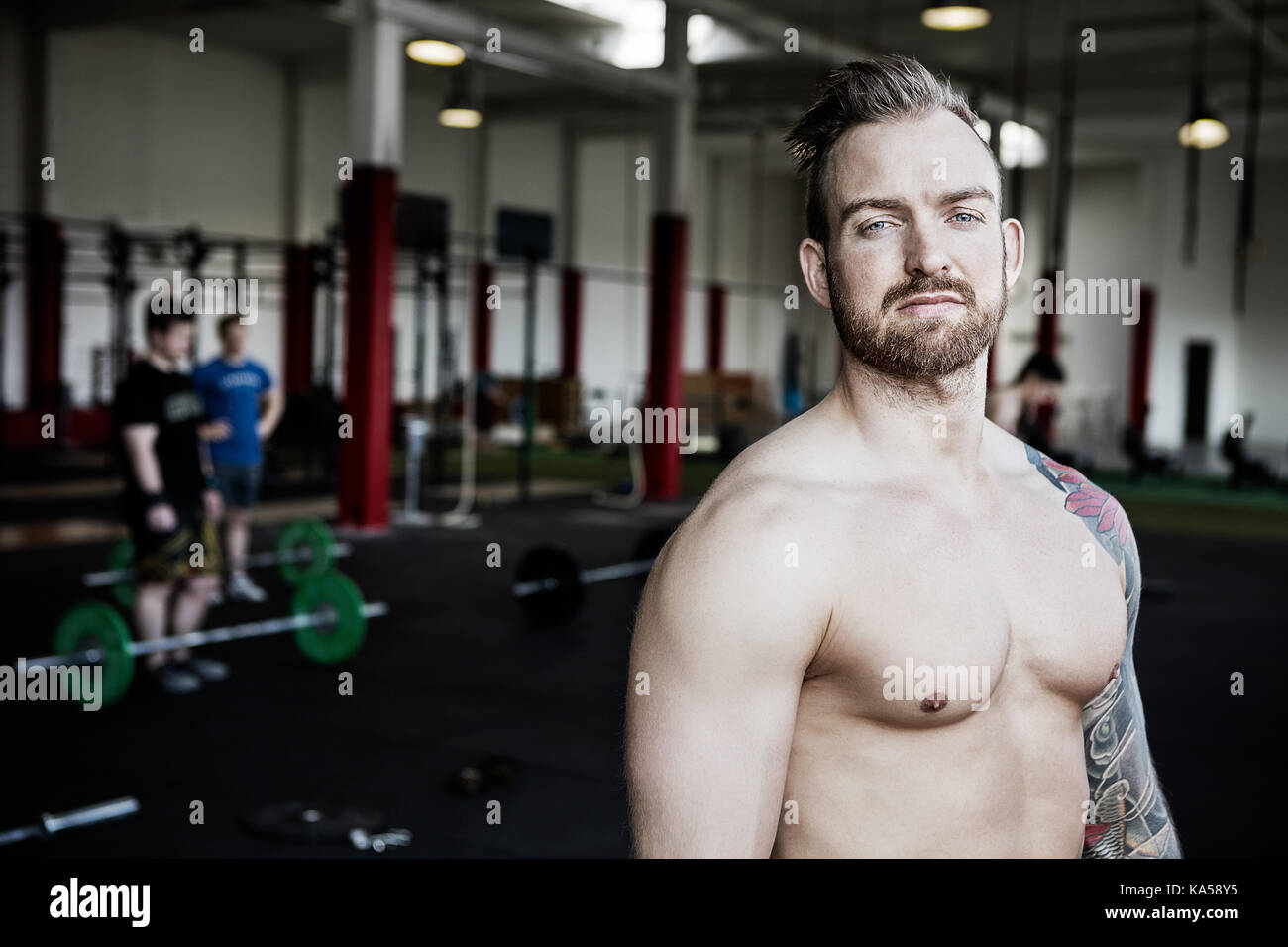Muscular Proud Man Standing In Fitness Club Stock Photo - Alamy